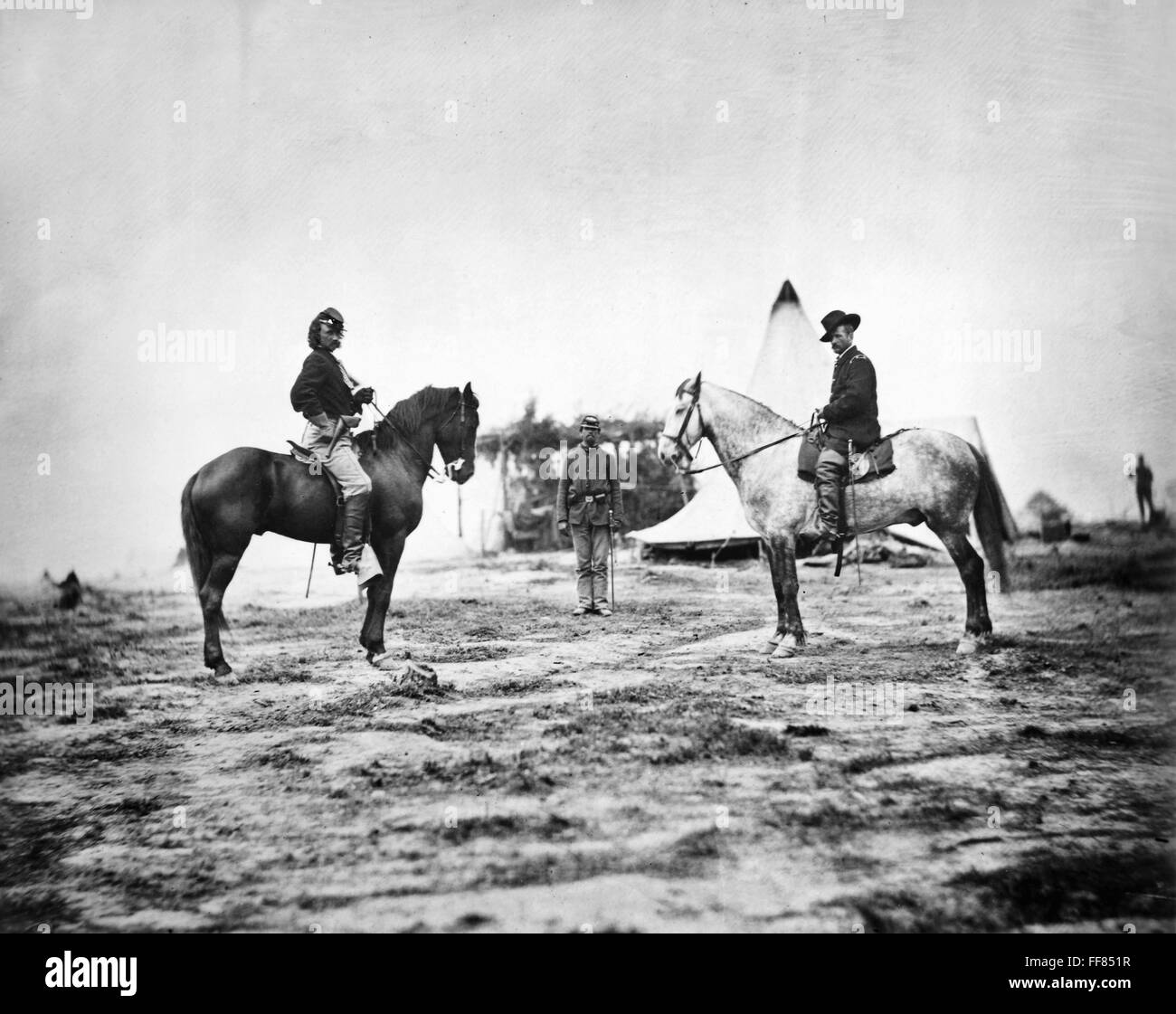 GEORGE CUSTER (1839-1876). /nAmerican army officer. Custer, left, as a ...