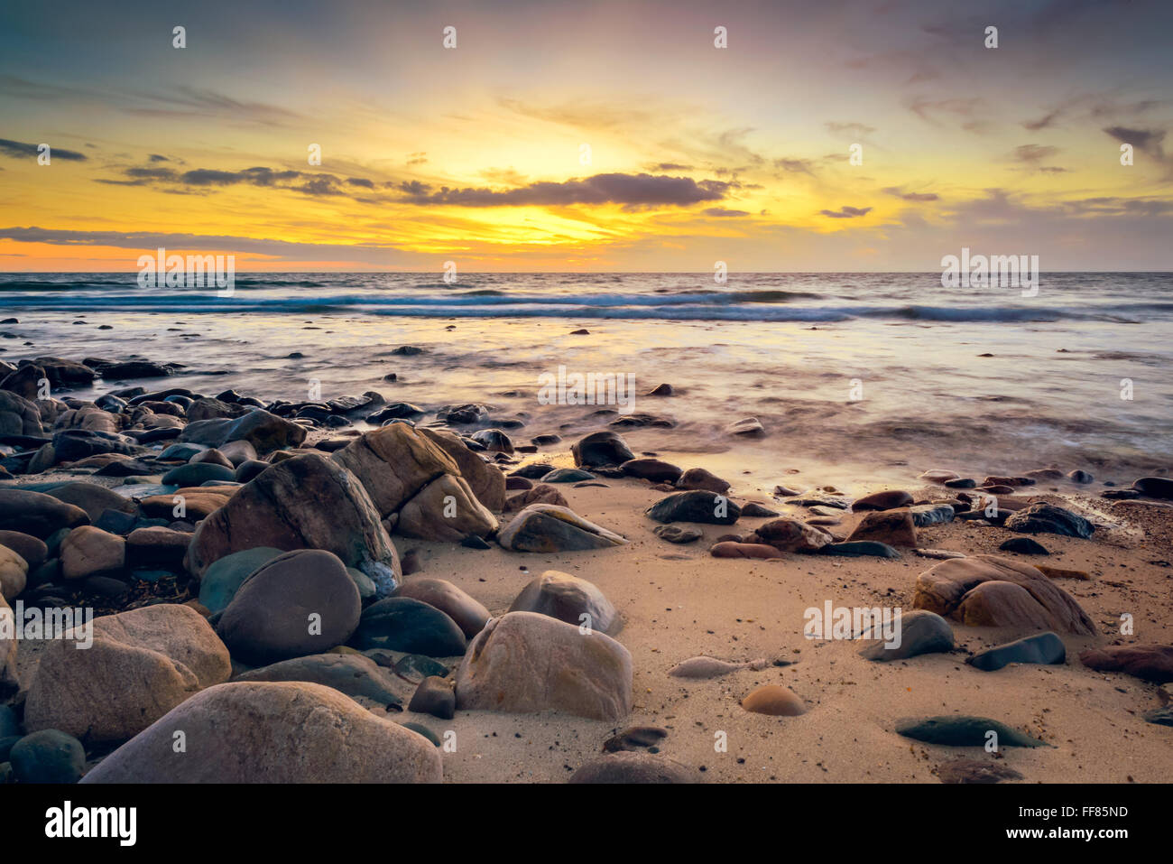 Dramatic sunset at Marino Rocks, South Australian coast. Color toning ...
