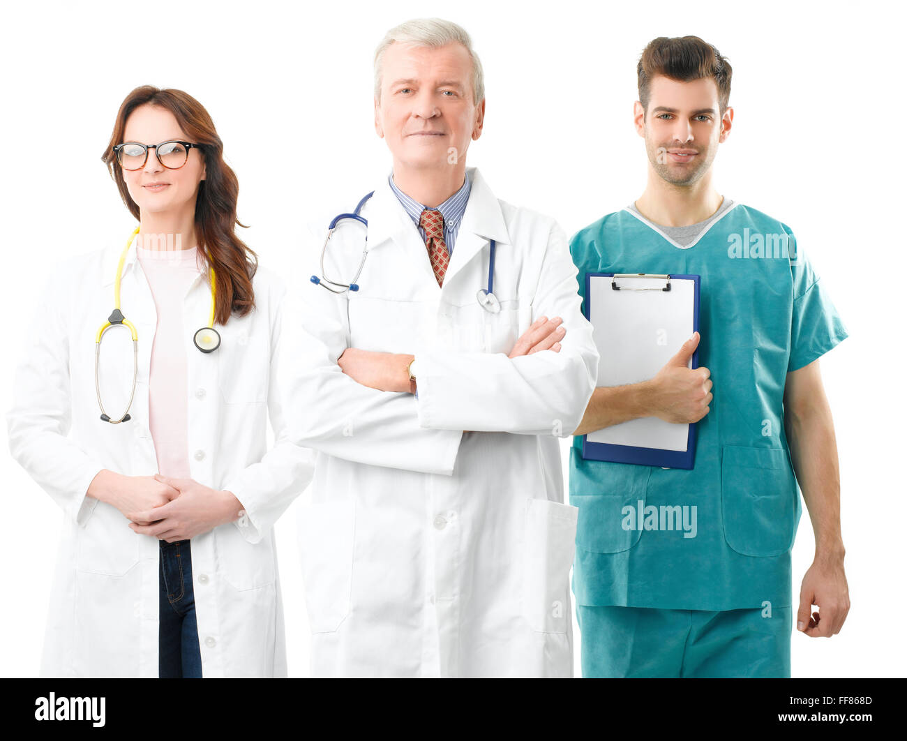 Three doctors standing against white background Stock Photo - Alamy