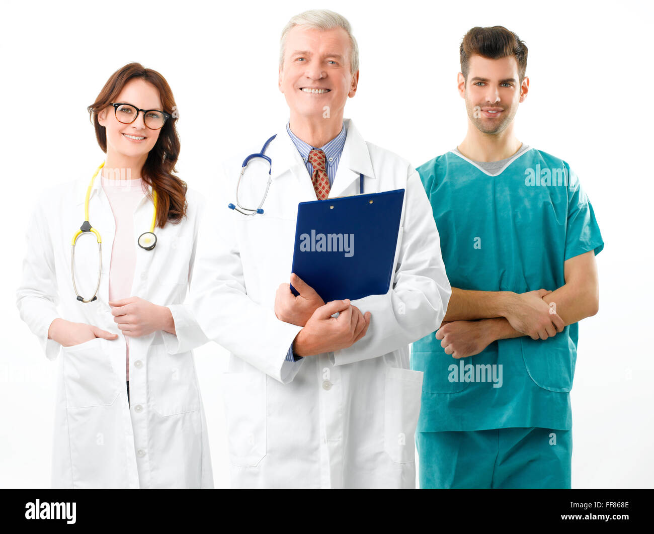Three doctors standing against white background Stock Photo - Alamy