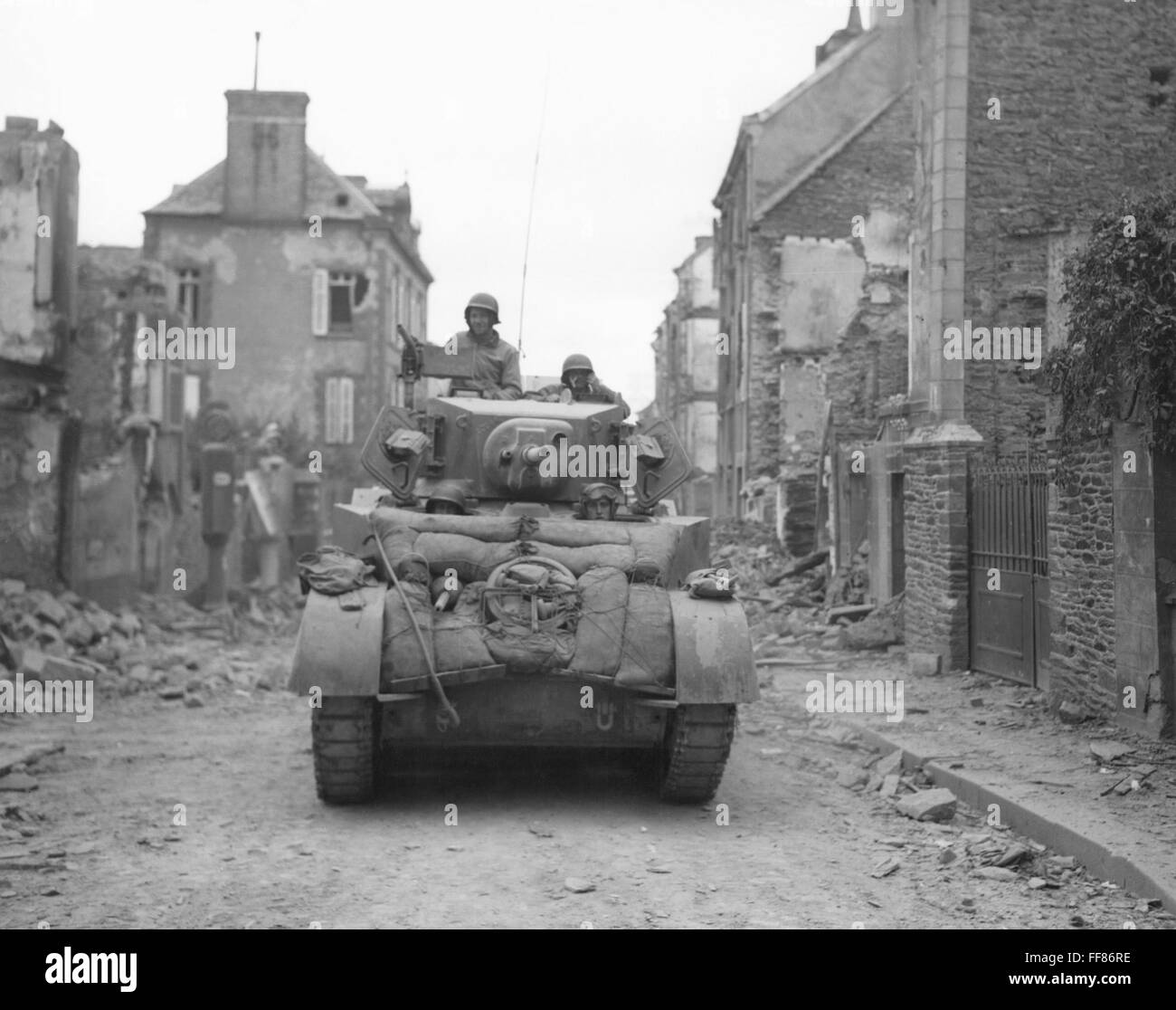 WORLD WAR II: NORMANDY. /nAn American tank moving through liberated ...