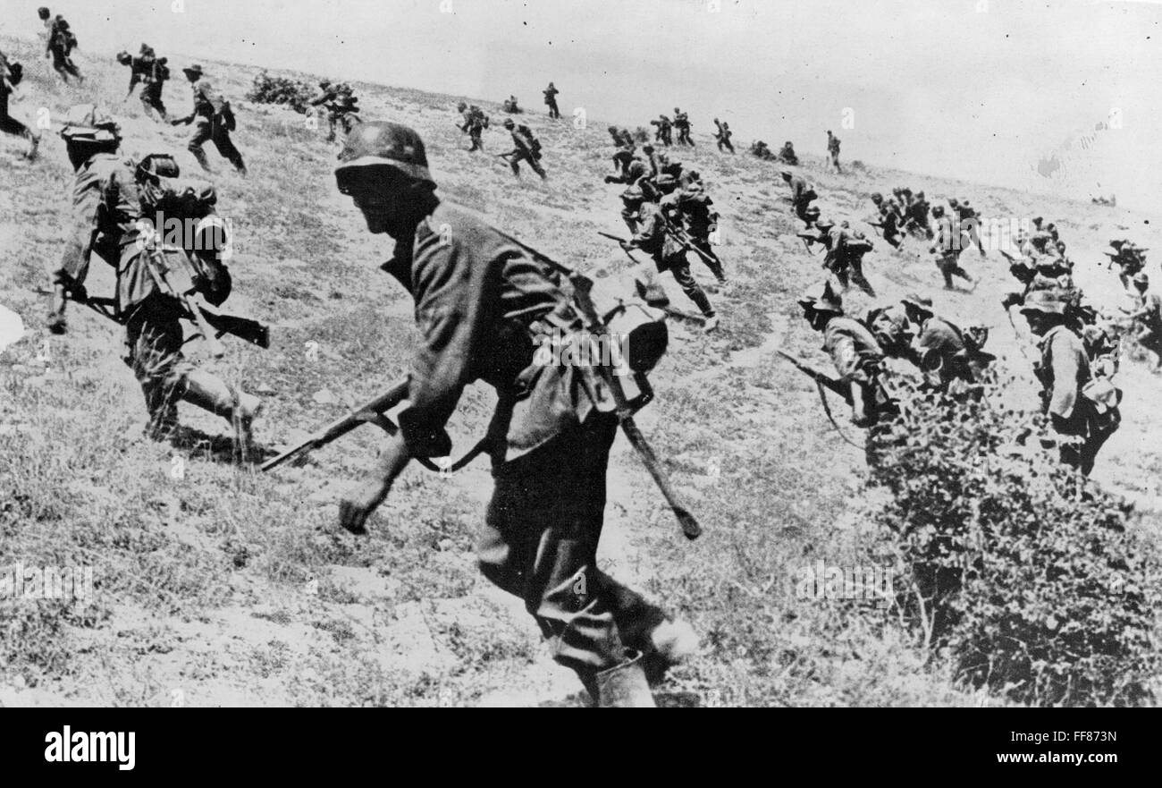WWII: STALINGRAD ATTACK. /nGerman troops charging up a hill near ...
