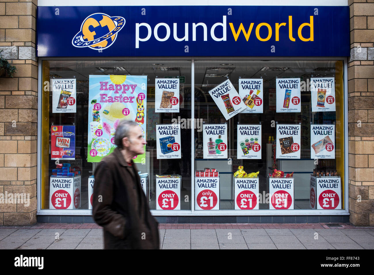An old British man walks past a £1 pound world shop in Middlesborough ...