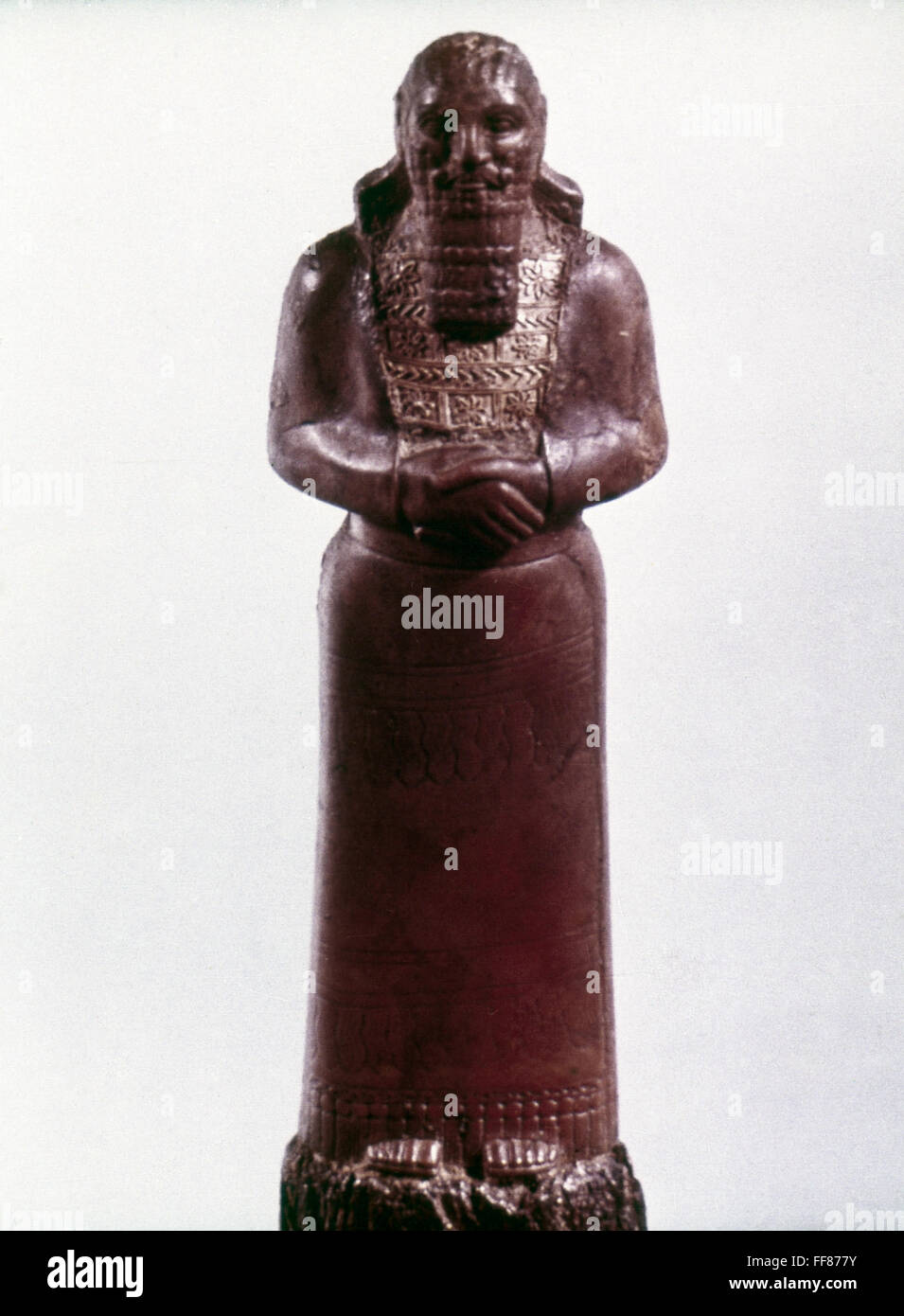 ASSYRIAN STATUE. /nAssyrian royal statue (Ashurnasirpal?) of amber. 9th ...