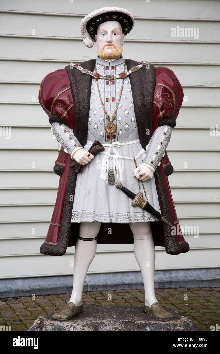 A statue of King Henry VIII of England outside the Mary Rose Museum in ...