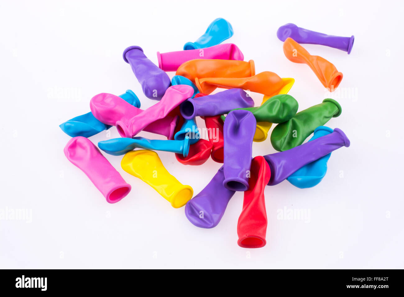 Heap Of Colorful Empty Balloons on a white background Stock Photo - Alamy