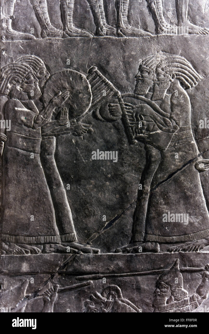 ASSYRIAN MUSICIANS. /nMusicians performing on an Assyrian alabaster ...