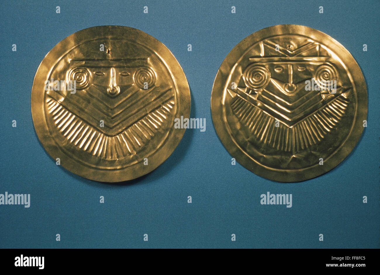 INCAN GOLD, COLOMBIAN. /nTwo Incan gold discs with sun faces Stock ...