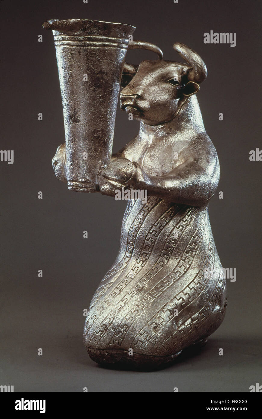 IRAN: BULL VESSEL. /nSilver figurine of a kneeling bull holding a ...