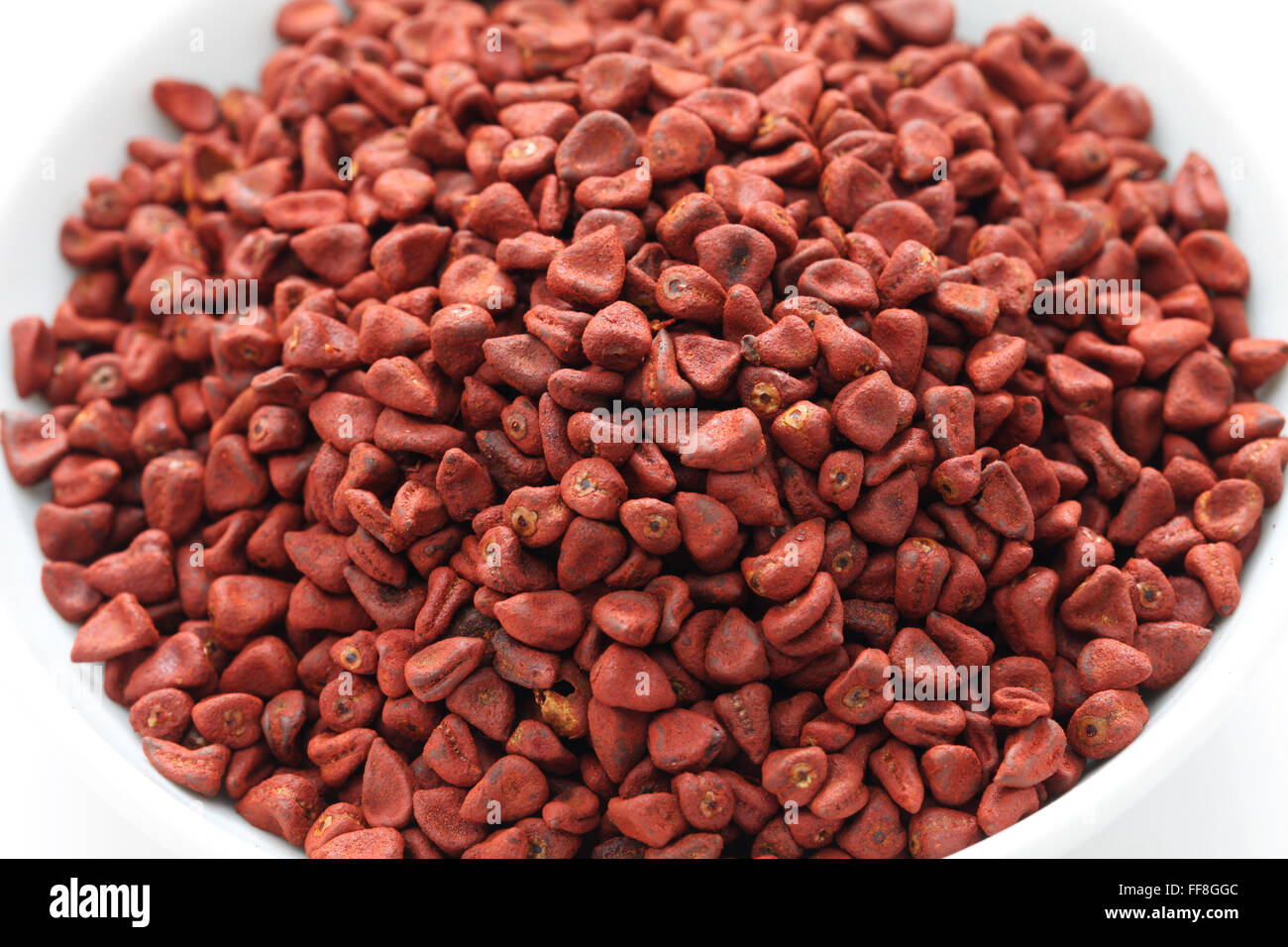 annatto seeds, achiote seeds, bixa orellana seeds isolated on white ...