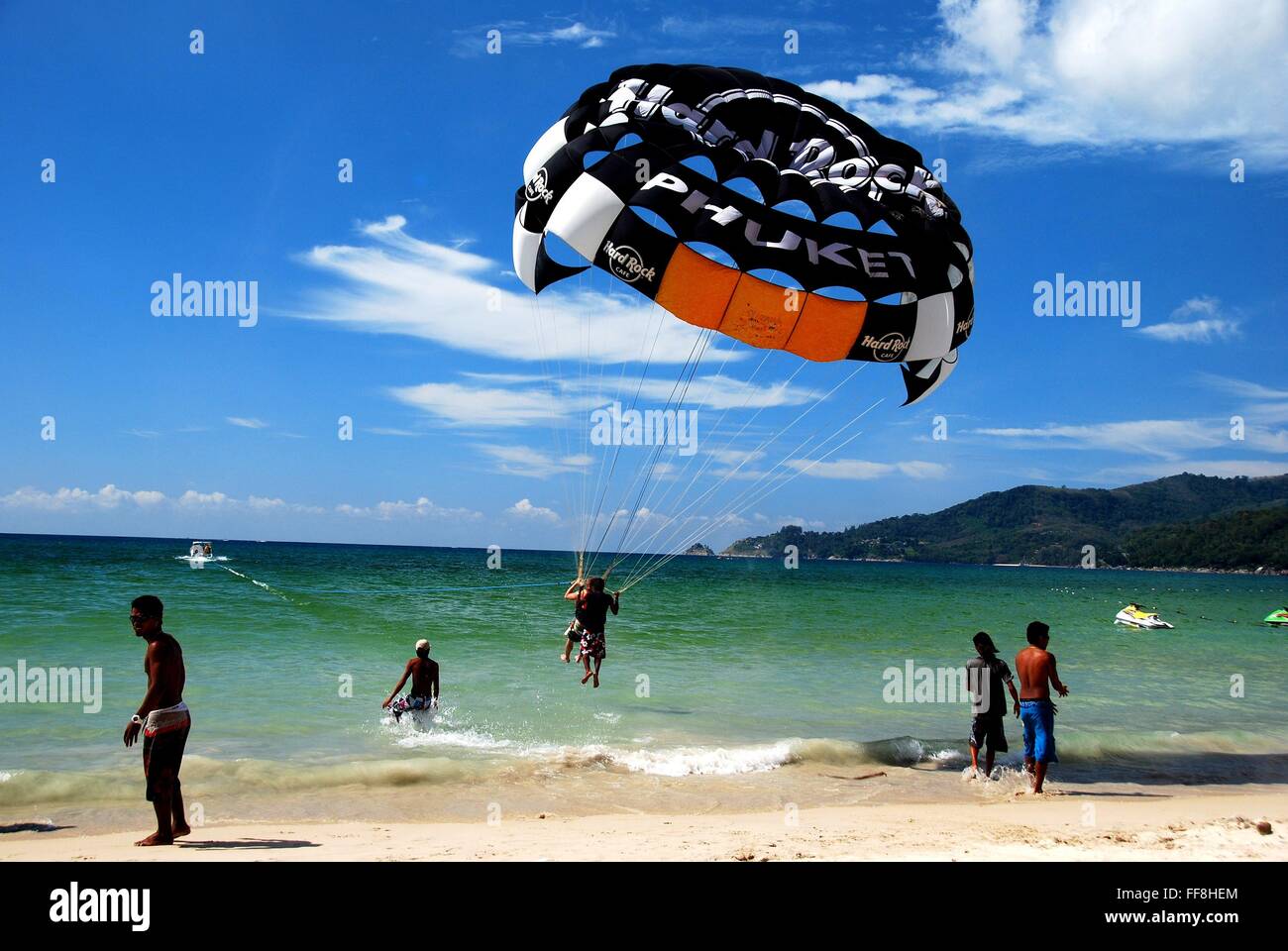 Phuket, Thailand: Tourist takes to the air from Patong Beach for a ...