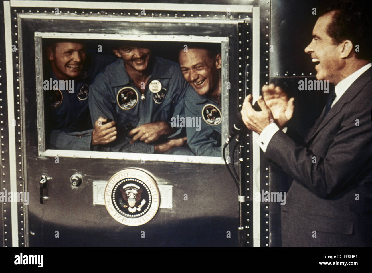 SPACE: APOLLO 11. /nPresident Richard M. Nixon applauds astronauts Neil ...