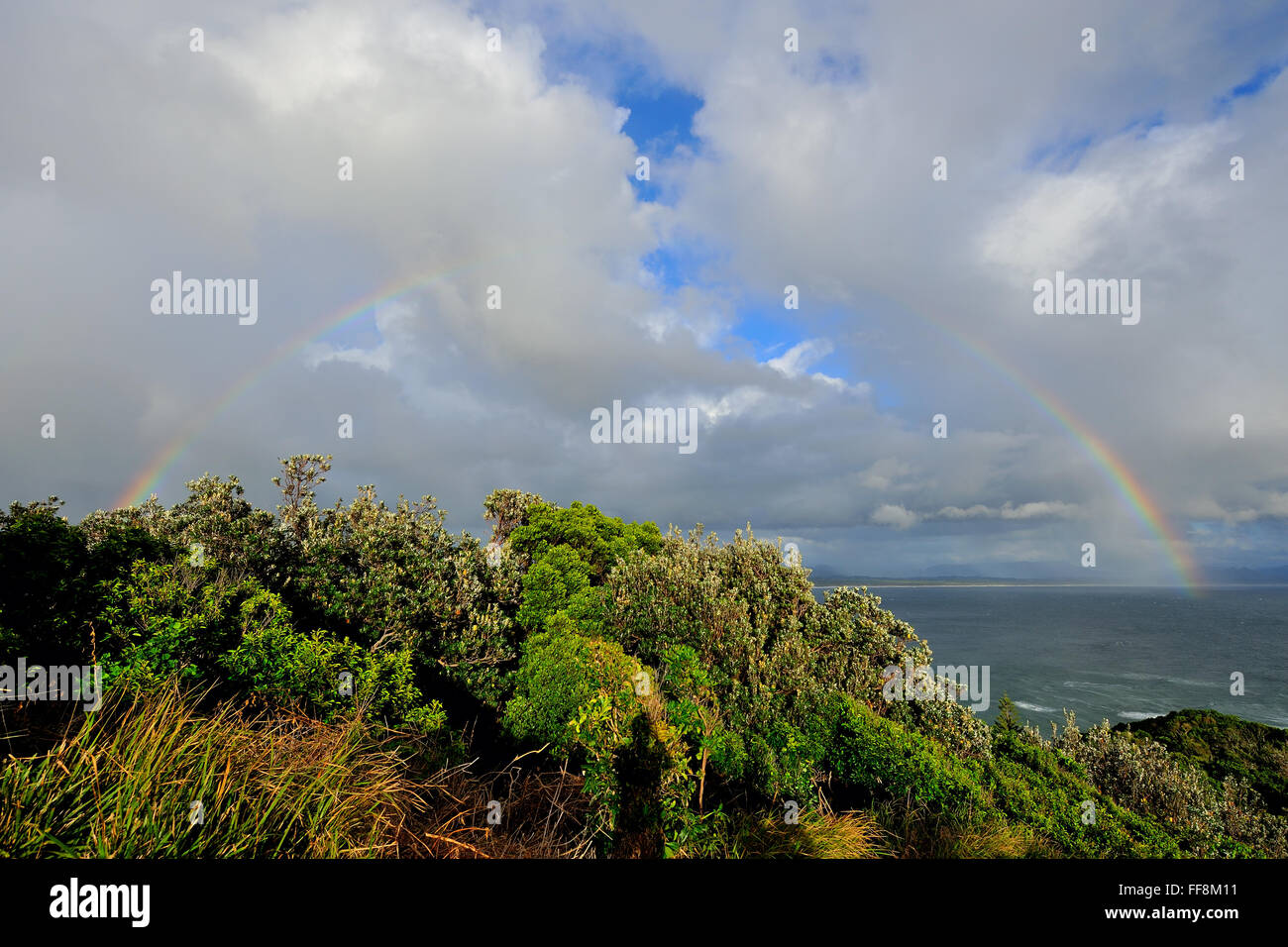 Perfect rainbow over the ocean at Cape Byron Stock Photo - Alamy