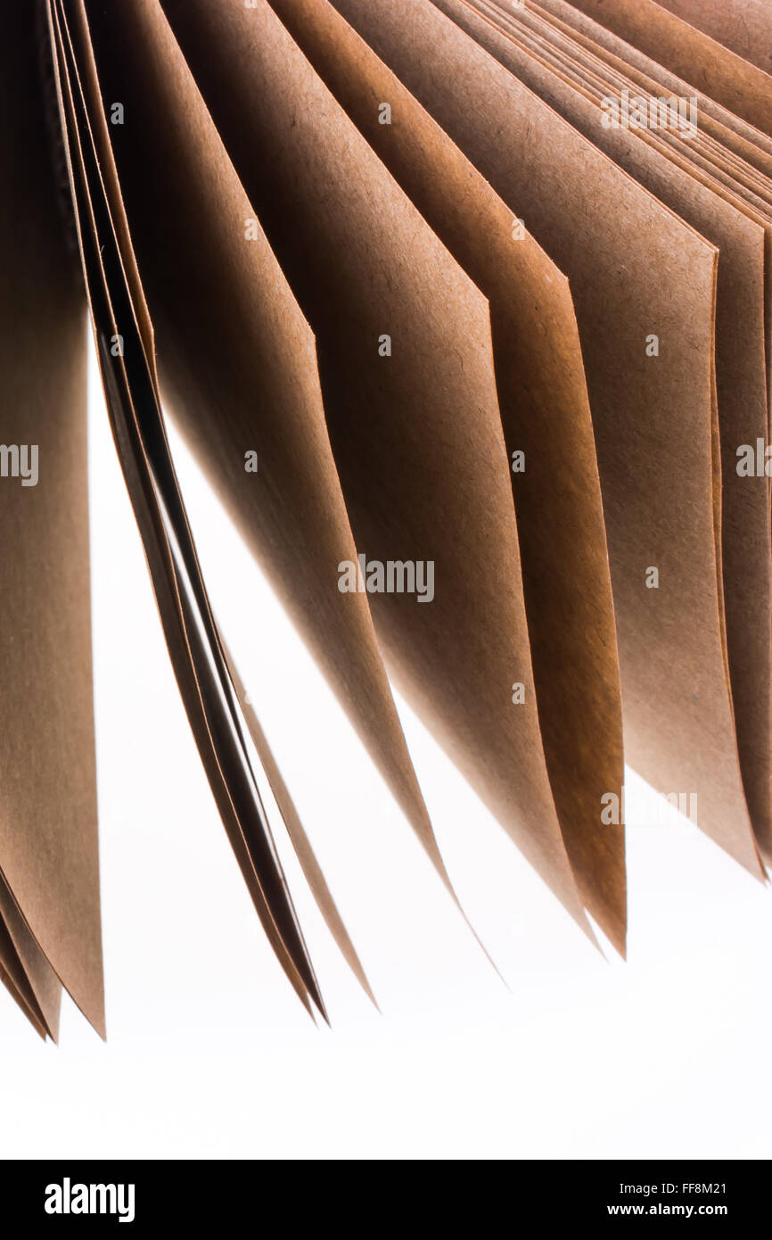 Brown notebook pages open on a white background Stock Photo - Alamy