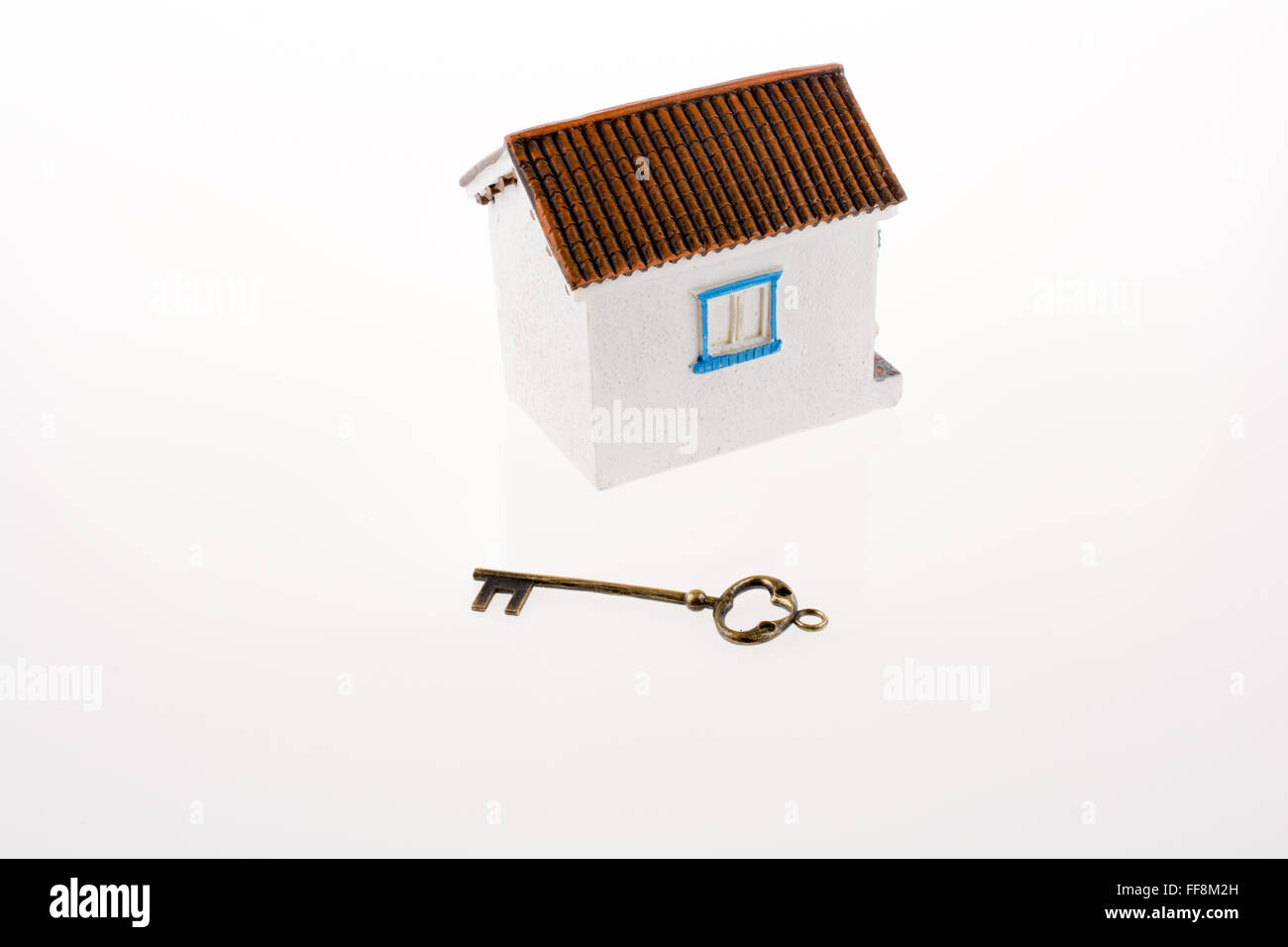 key and house on white background Stock Photo - Alamy