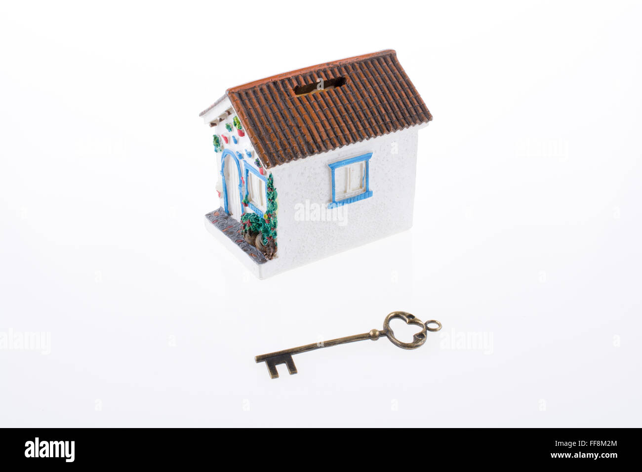 key and house on white background Stock Photo - Alamy
