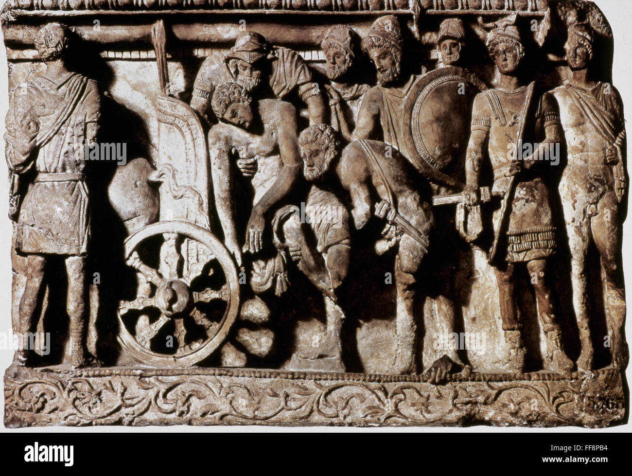 WOUNDED ETRUSCAN. /nDetail from Etruscan urn with comrades lifting ...