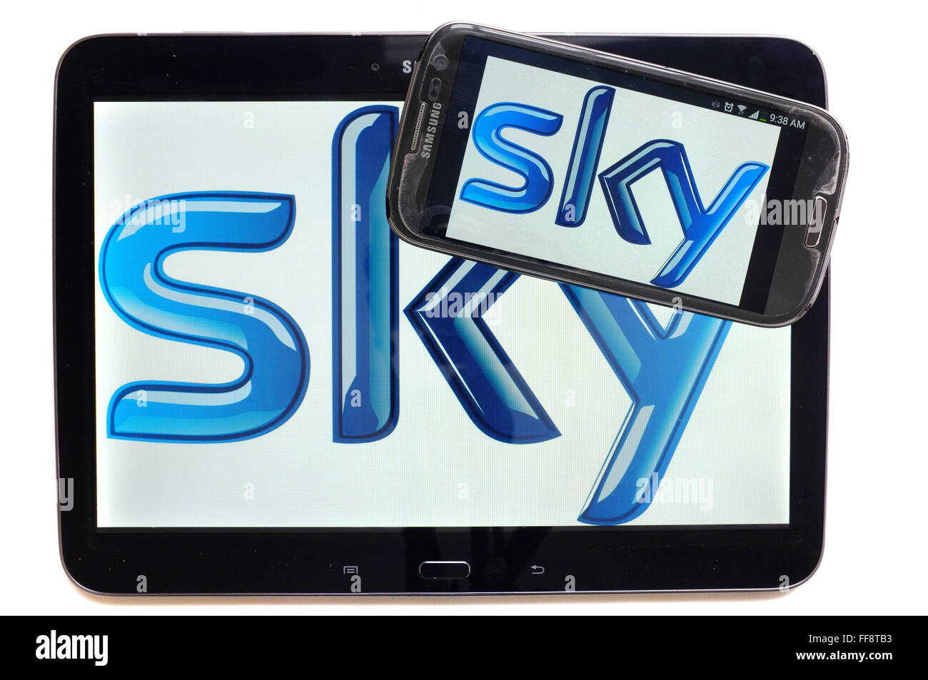 The Sky logo on smartphone and tablet screens photographed against a ...