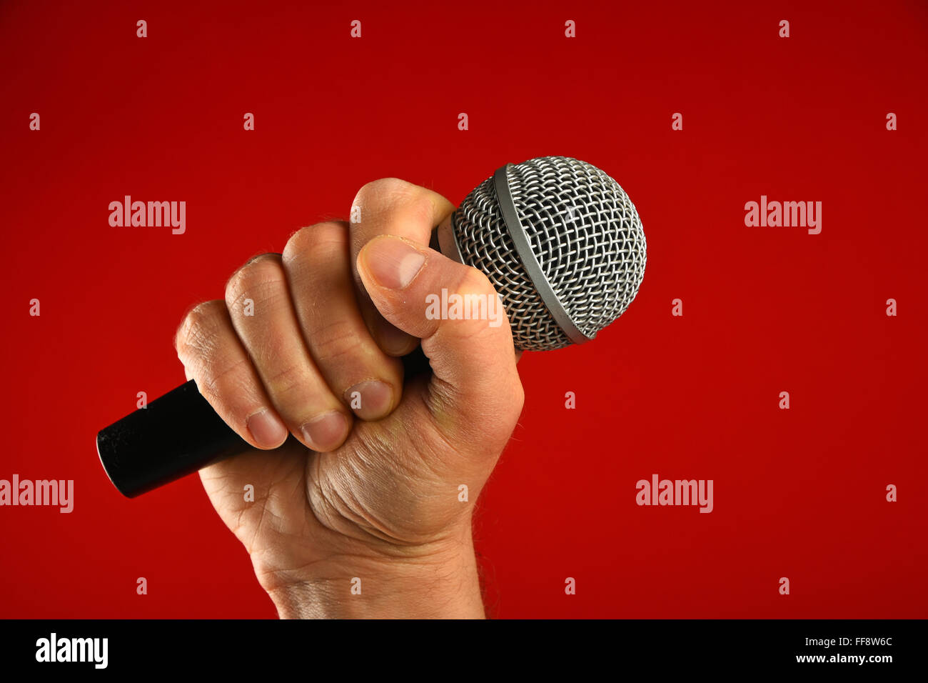Microphone hand holding sound hi-res stock photography and images - Alamy