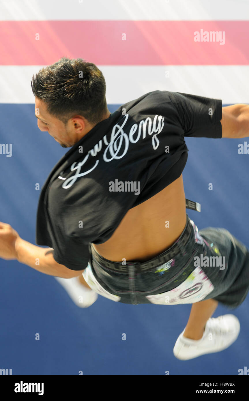A young man spinning in the air during a break dance routine Stock ...