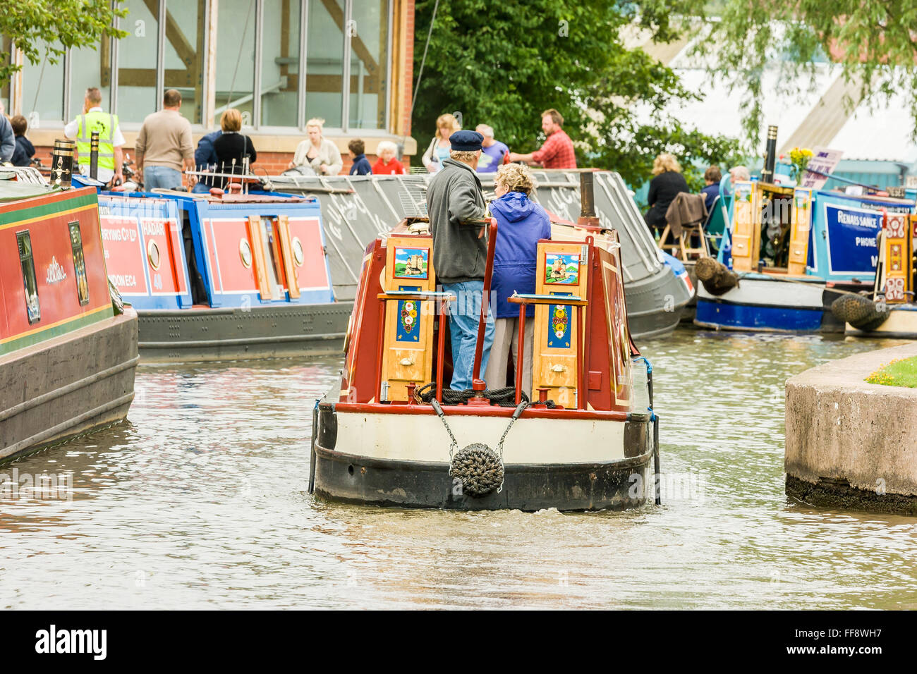 Elderly couple navigating boat hi-res stock photography and images - Alamy