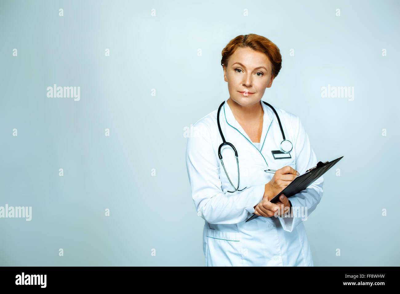 Beautiful successful female doctor stethoscope hi-res stock photography ...