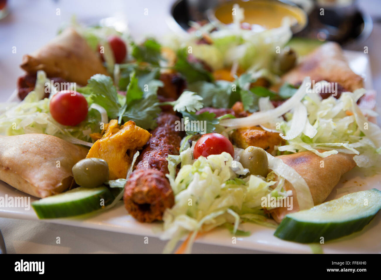 Spicy lamb starter plate at an Indian restaurant Stock Photo - Alamy