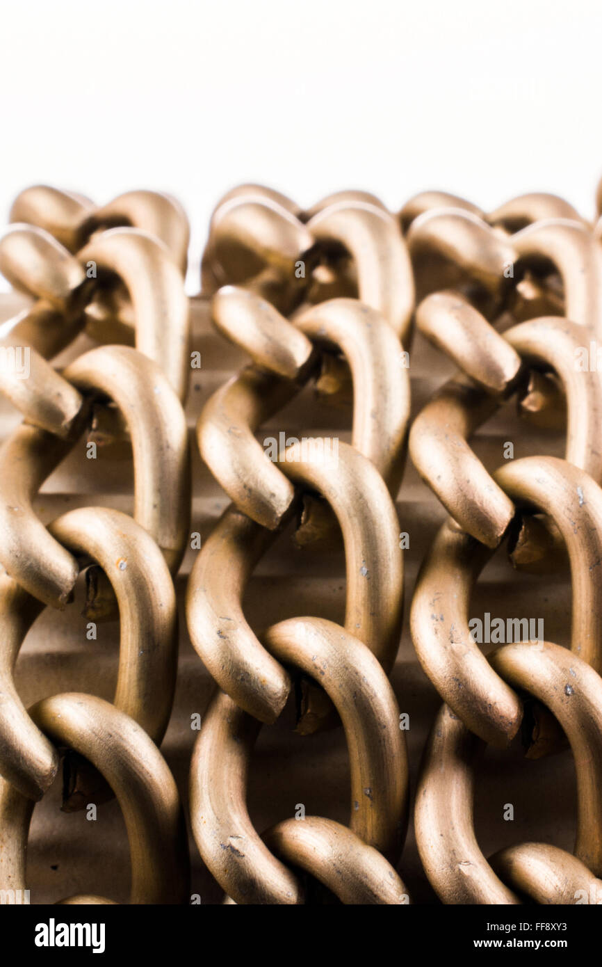 gold color metal chain on white background Stock Photo - Alamy