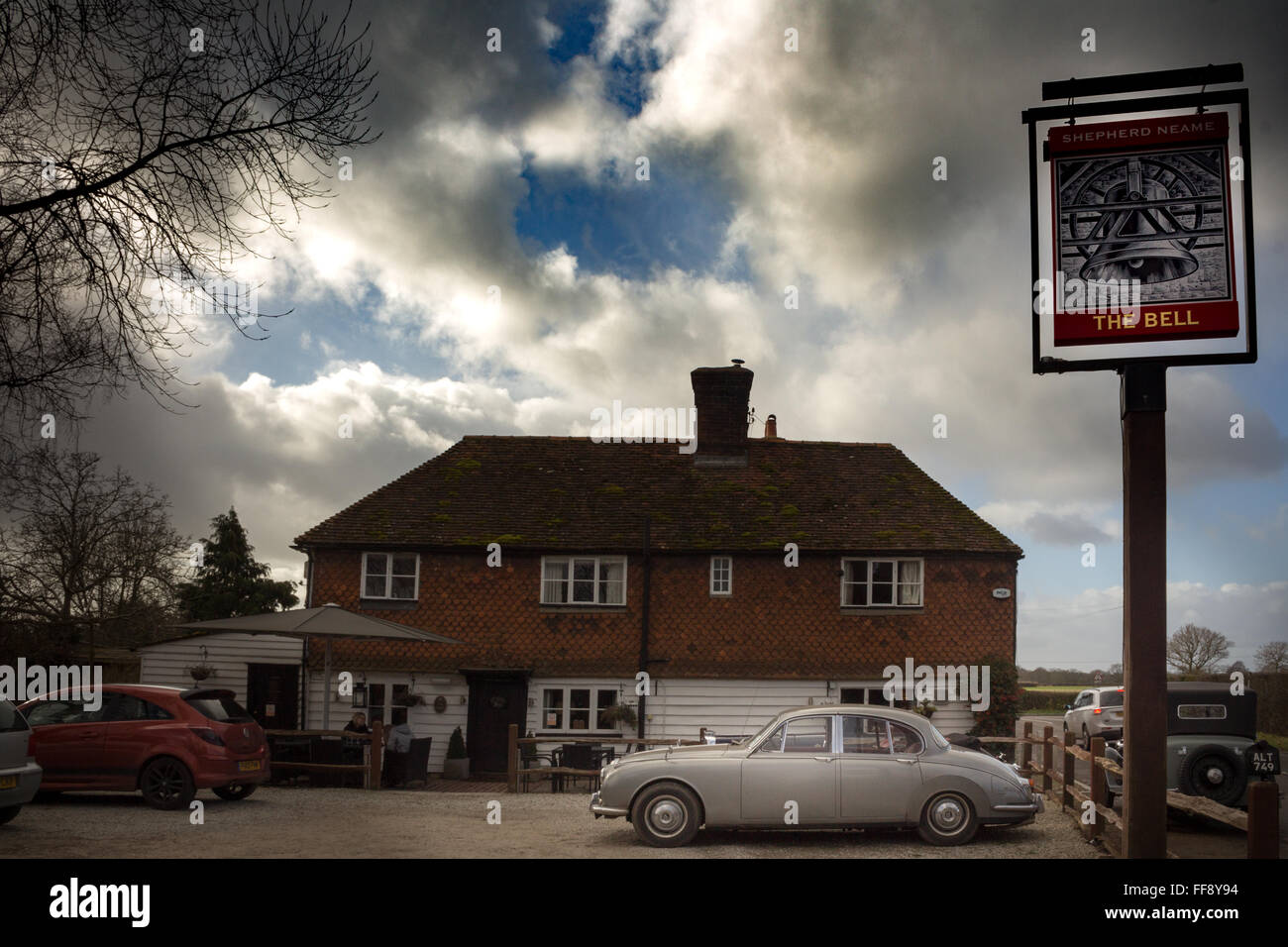 The Bell pub with vintage cars Stock Photo - Alamy