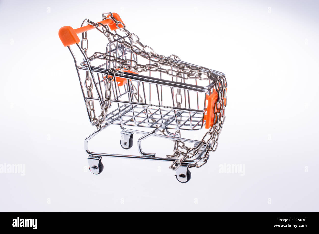Chained shopping cart in white background Stock Photo - Alamy