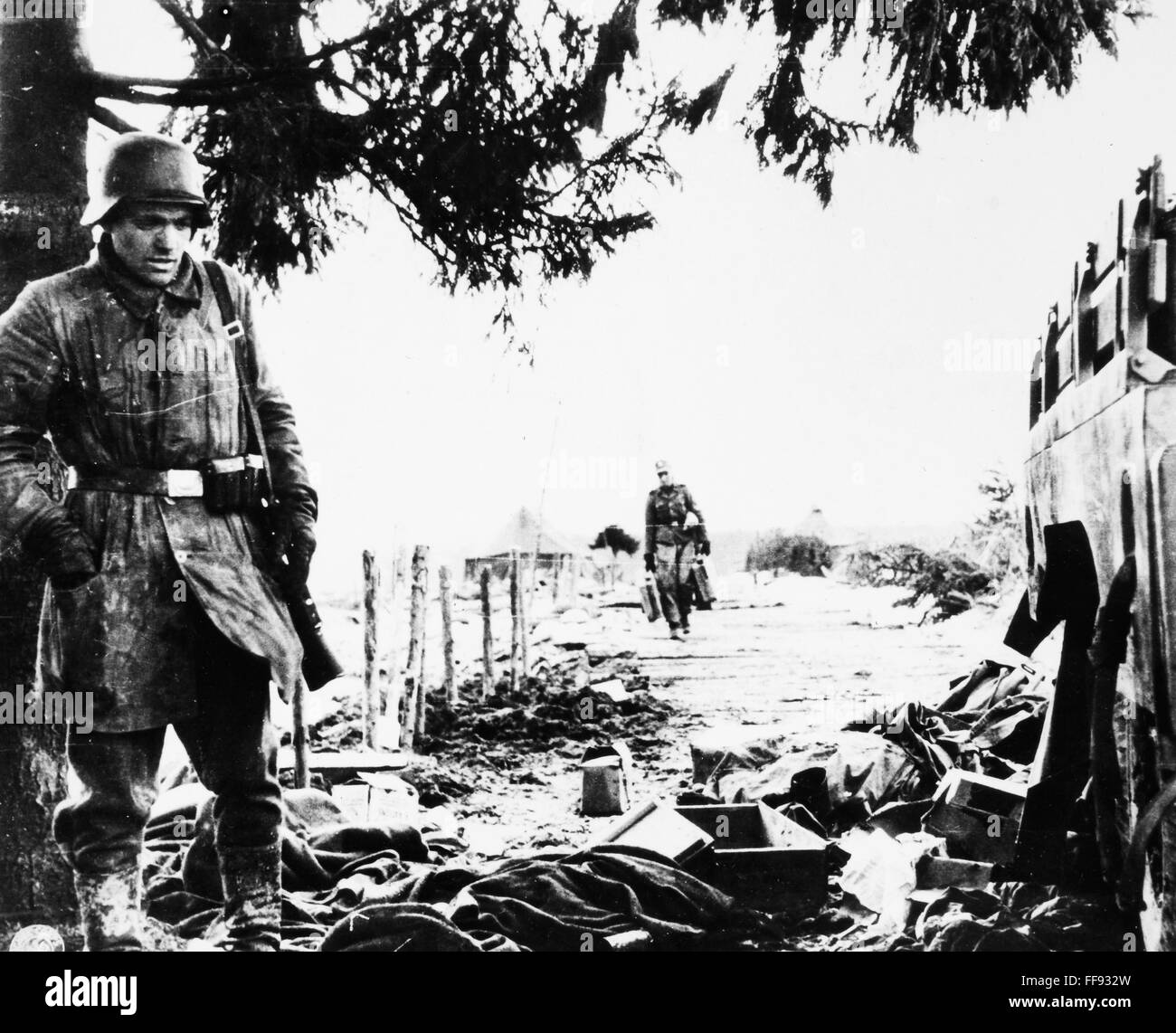 WORLD WAR II: BELGIUM, 1944. /nA German soldier examines litter left ...