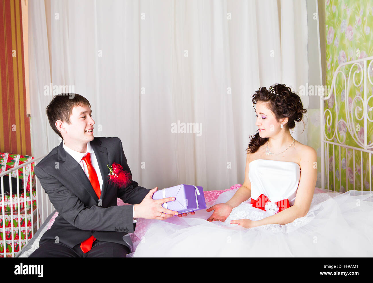 Gift boxes in bride hands Stock Photo - Alamy