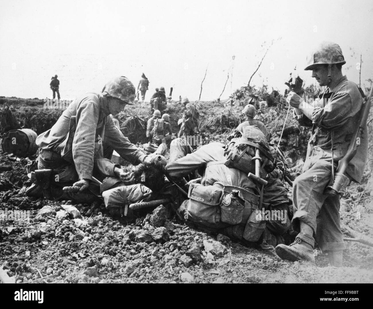 WORLD WAR II: MARINES, 1945. /nA wounded marine receiving blood plasma ...
