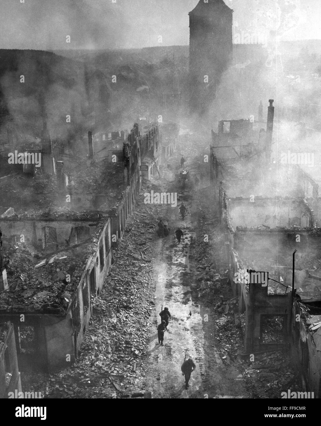 GERMAN RUINS, 1945. /nU.S. infantrymen move down a street in Waldenburg ...