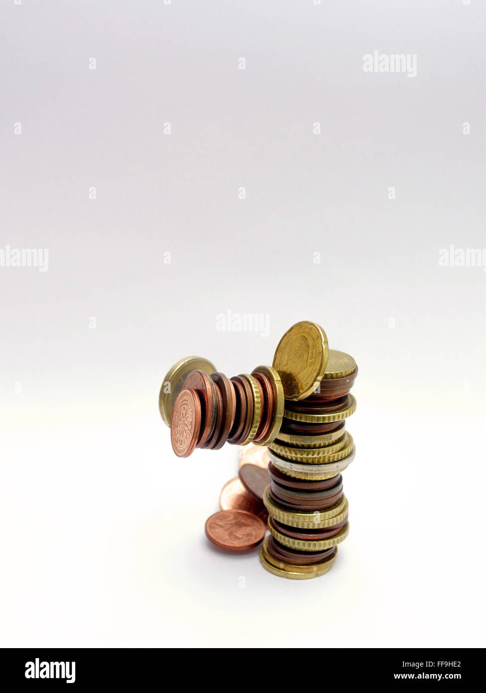 pile of Euro coins falling or collapsing Stock Photo - Alamy