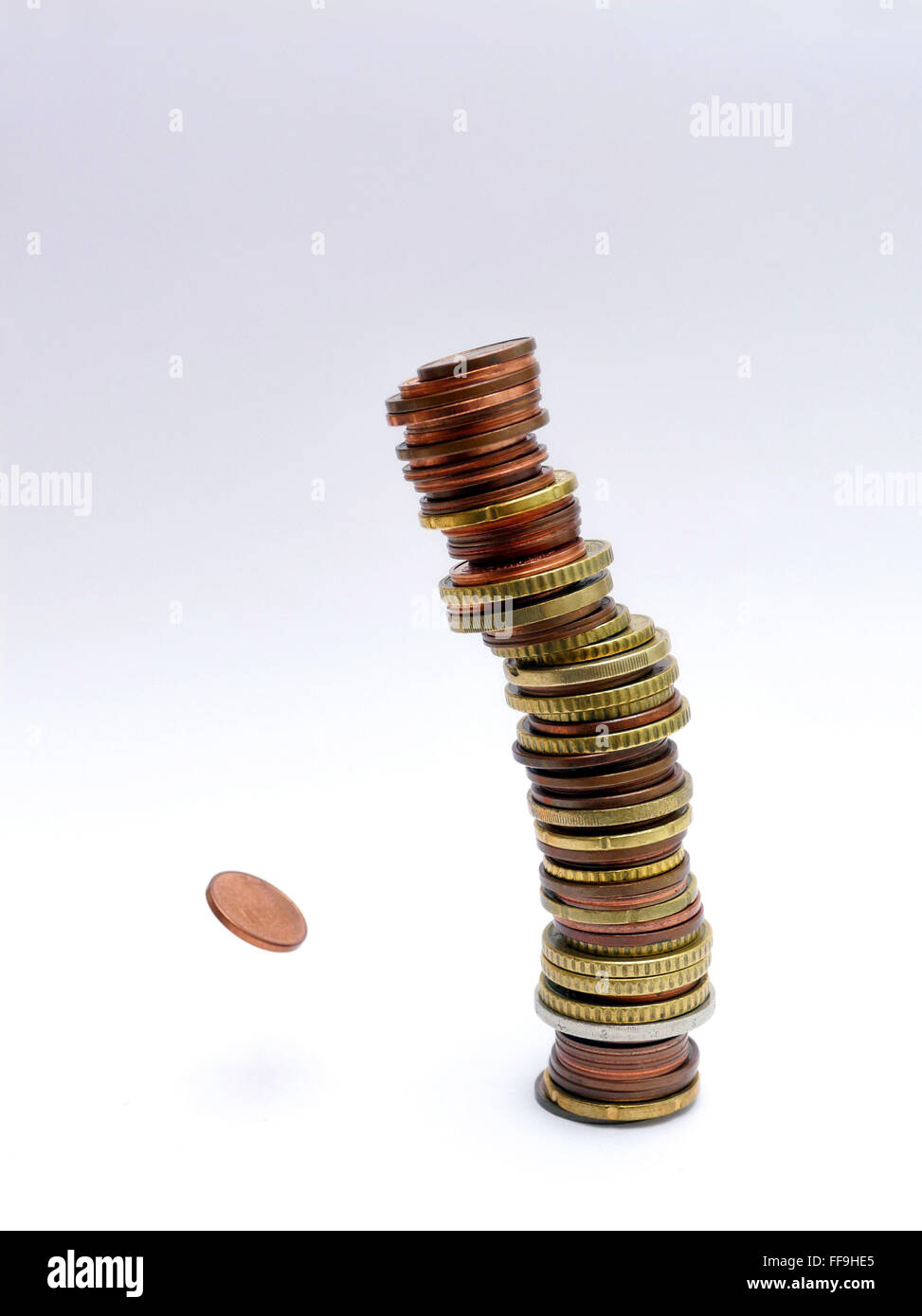 pile of Euro coins falling or collapsing Stock Photo - Alamy