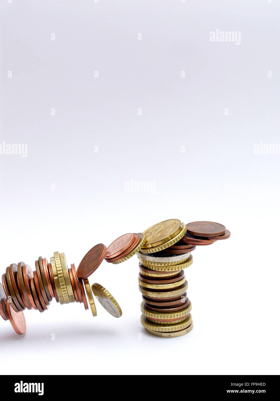 pile of Euro coins falling or collapsing Stock Photo - Alamy