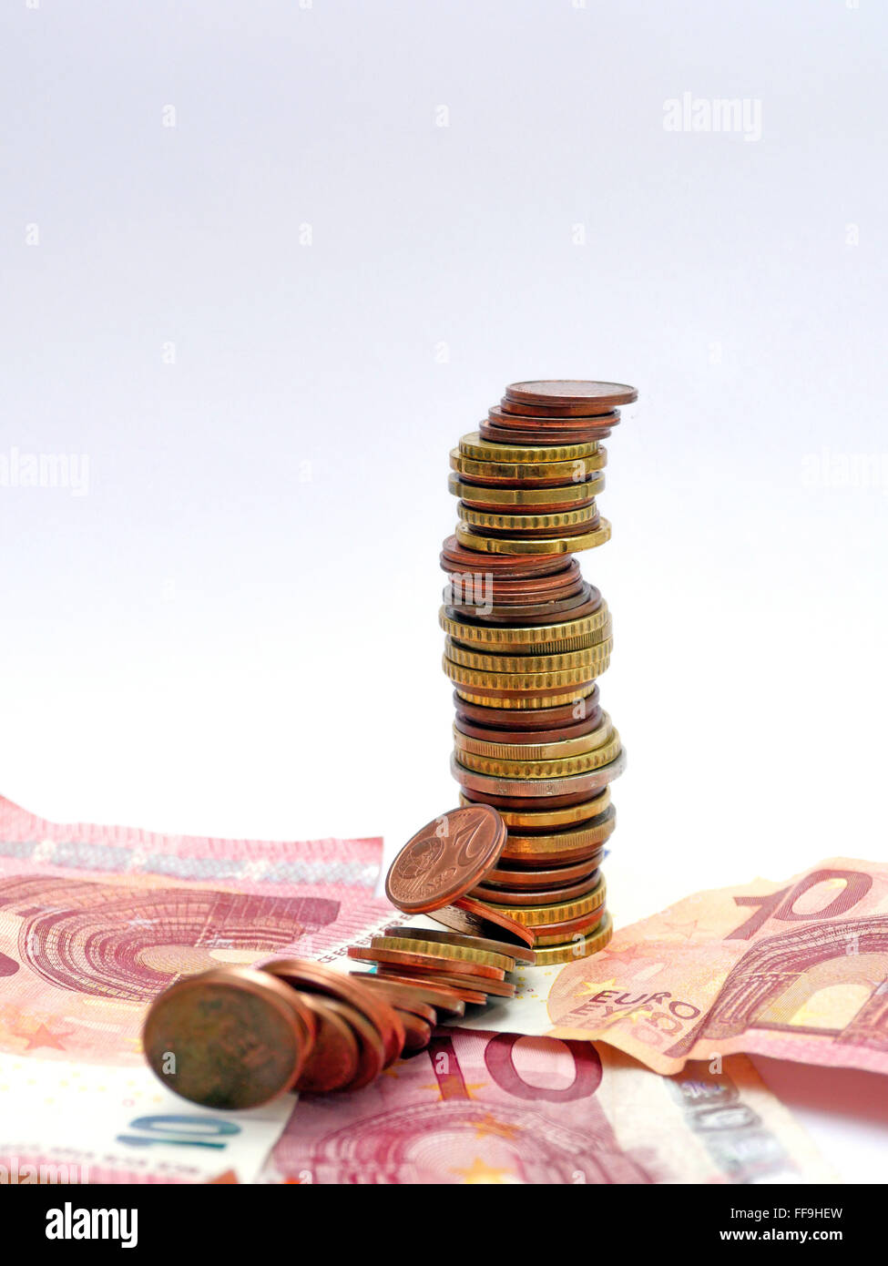 pile of Euro coins falling or collapsing Stock Photo - Alamy