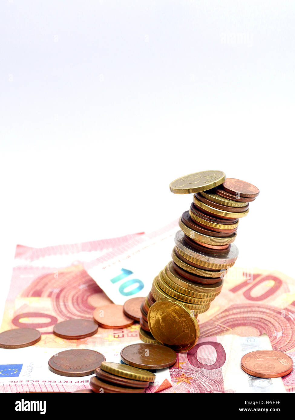 pile of Euro coins falling or collapsing Stock Photo - Alamy