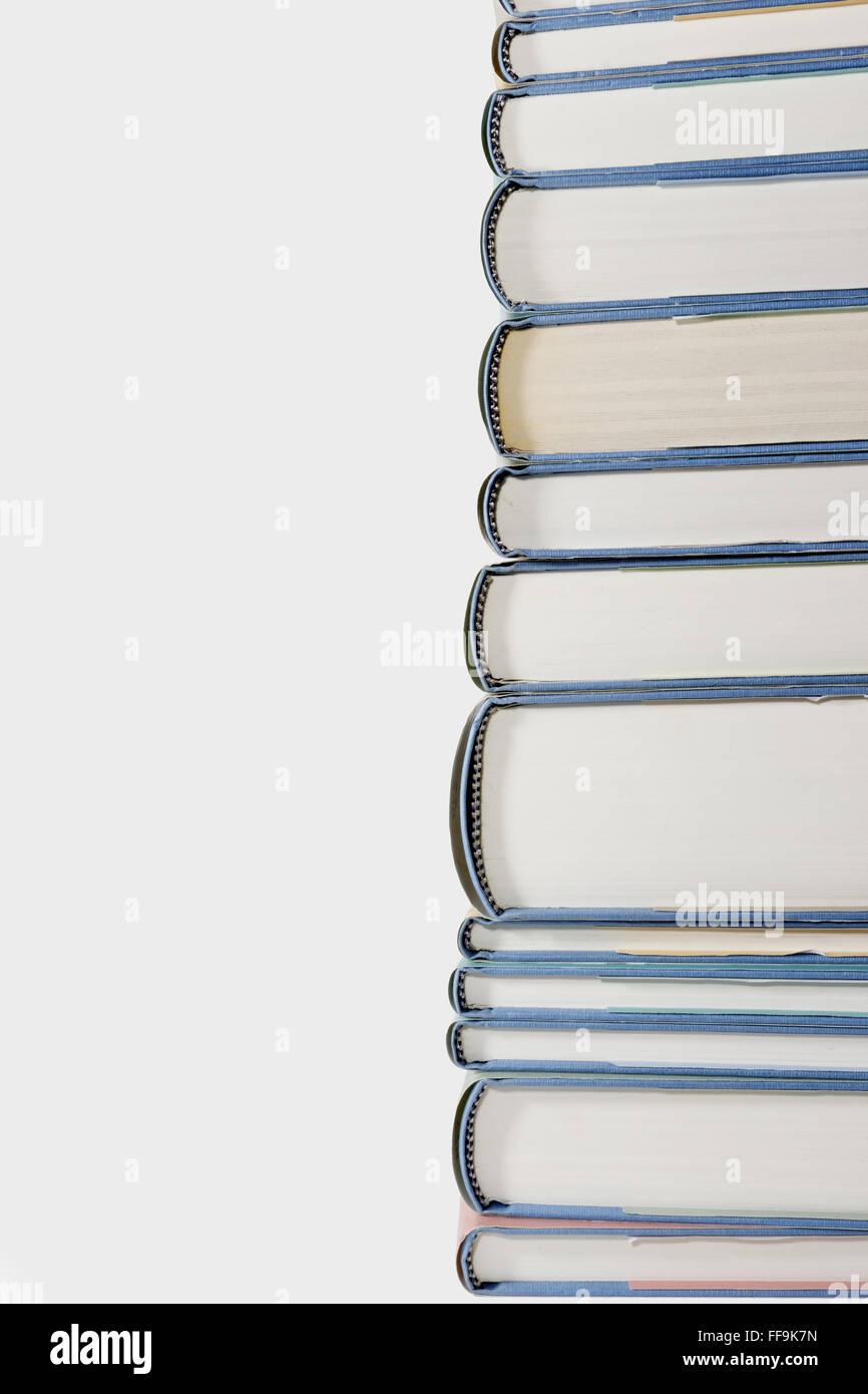 Stack of books isolated on white background, vertical Stock Photo - Alamy