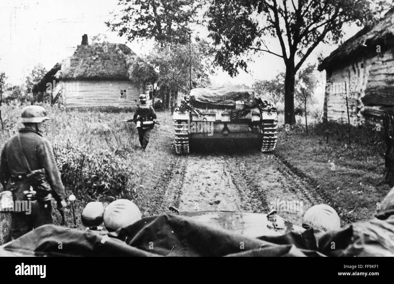 WORLD WAR II: GERMAN TANK. /nA German tank and troops advancing on a ...