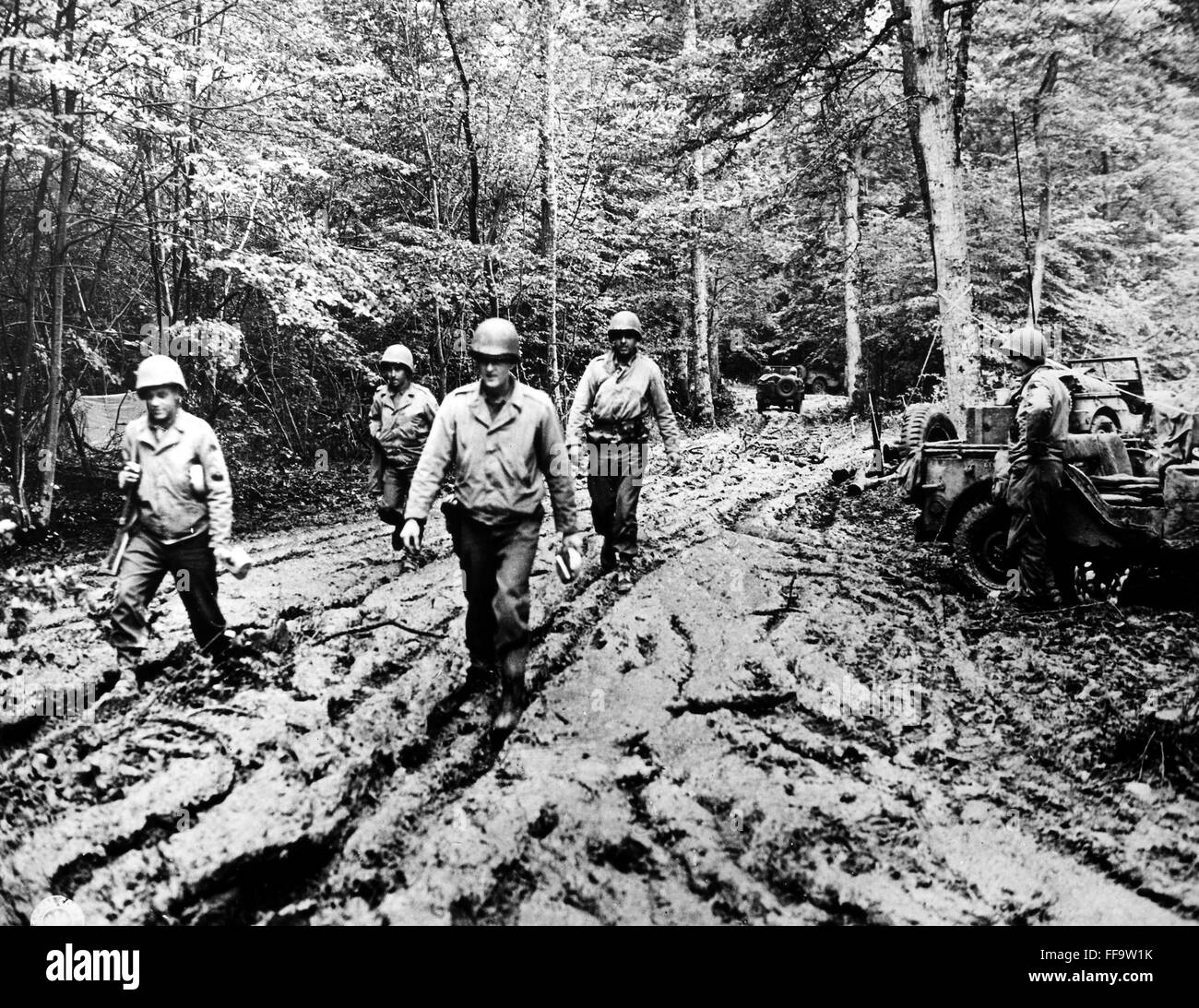 WORLD WAR II: U.S. TROOPS. /nAmerican soldiers slogging through the ...