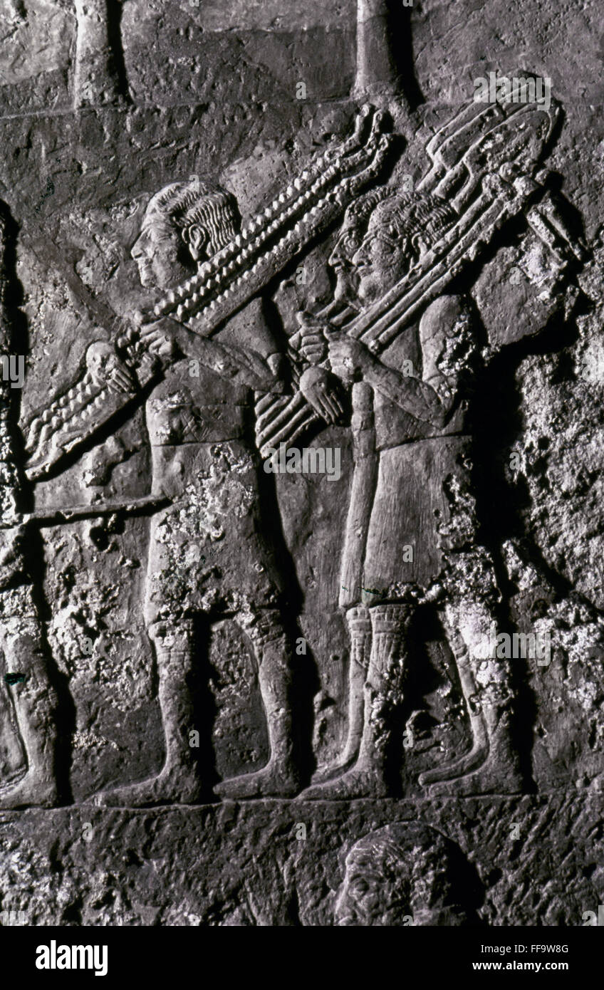 ASSYRIAN STONE CARVING. /nWorkmen's tools. Nineveh, c695 B.C Stock ...