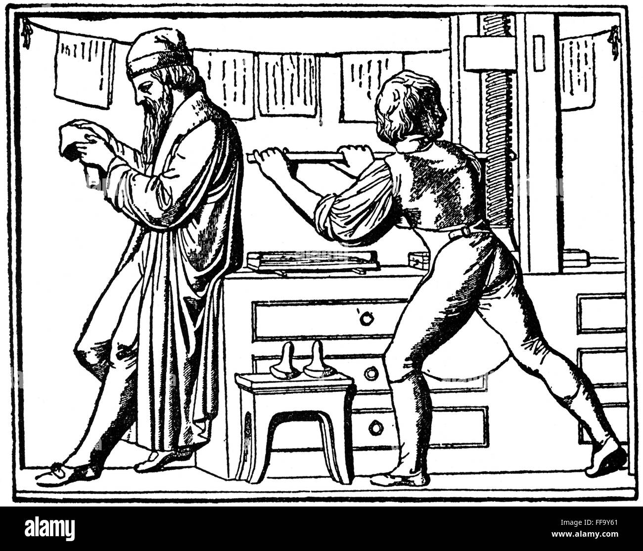 JOHANN GUTENBERG /n(1400?-1468). German printer. Gutenberg examining a ...