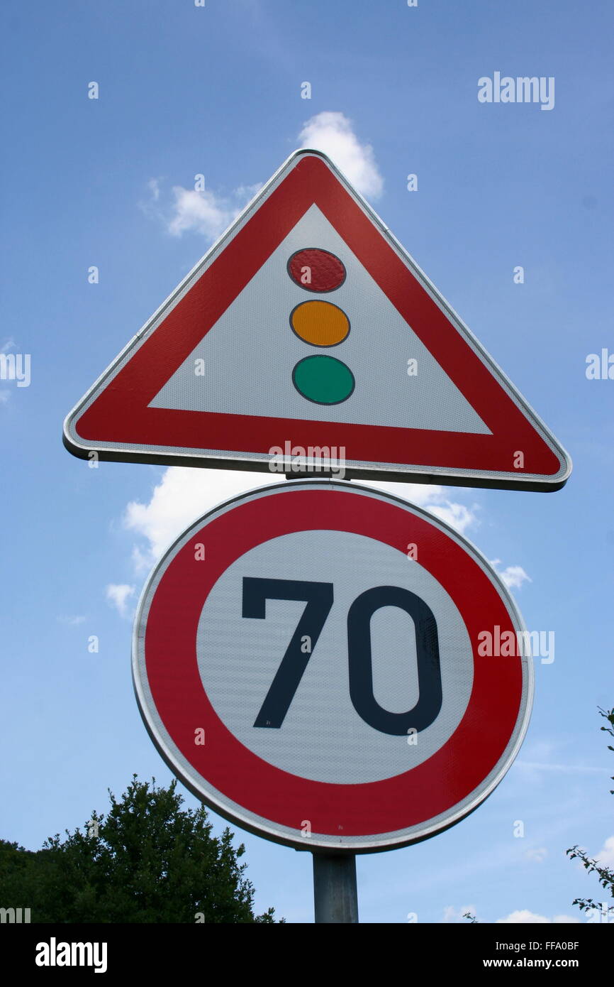 70 kilometer road sign and traffic signal warning sign, Germany Stock ...