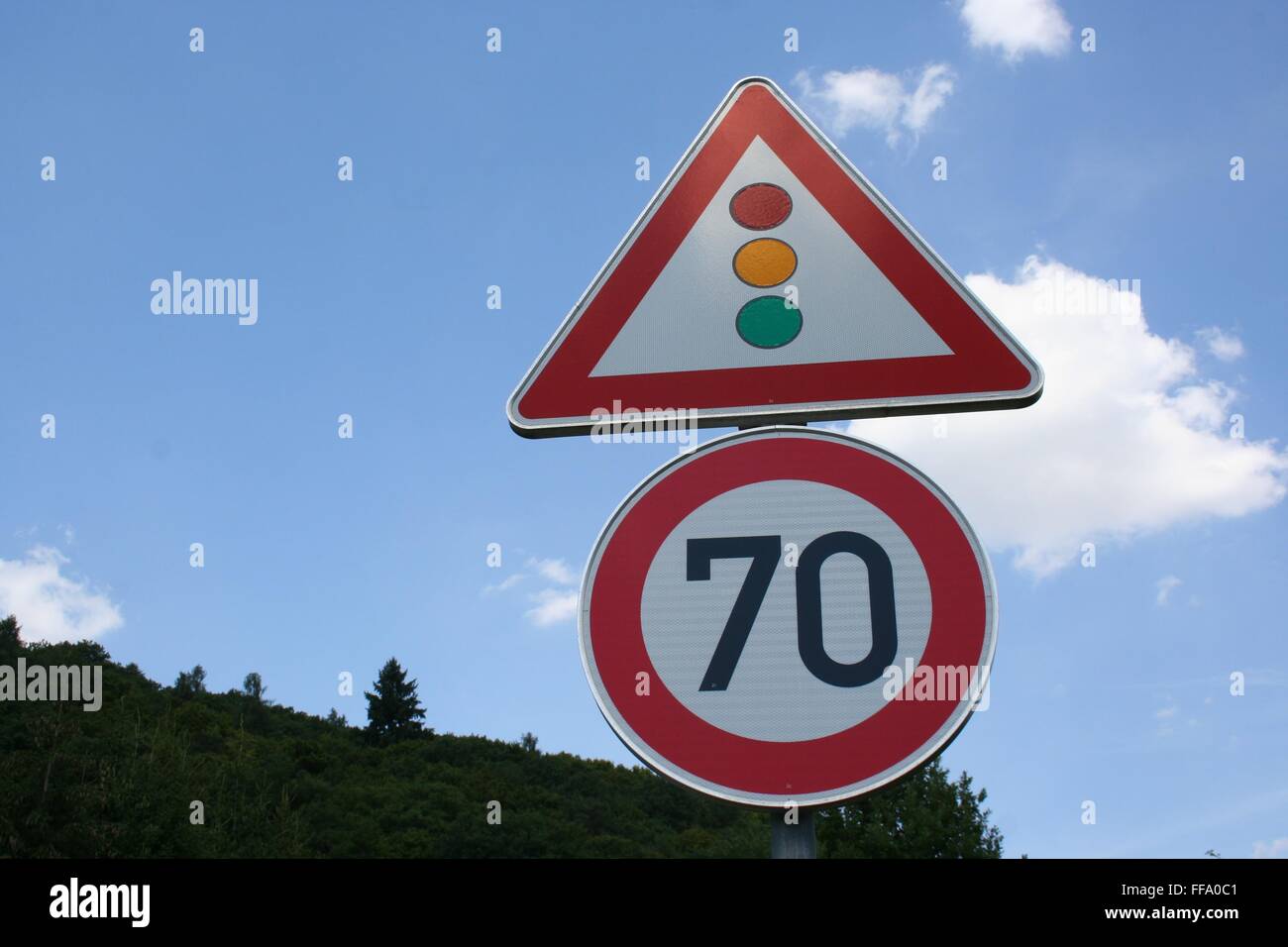 70 kilometer road sign and traffic signal warning sign, Germany Stock ...