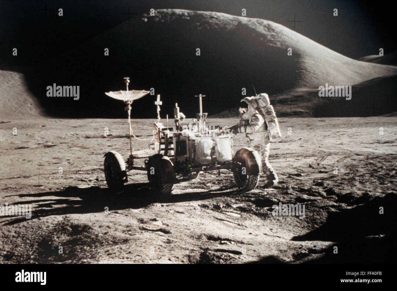 APOLLO 15, 1971. /nJim Irwin standing by the lunar rover, Mount Hadley ...