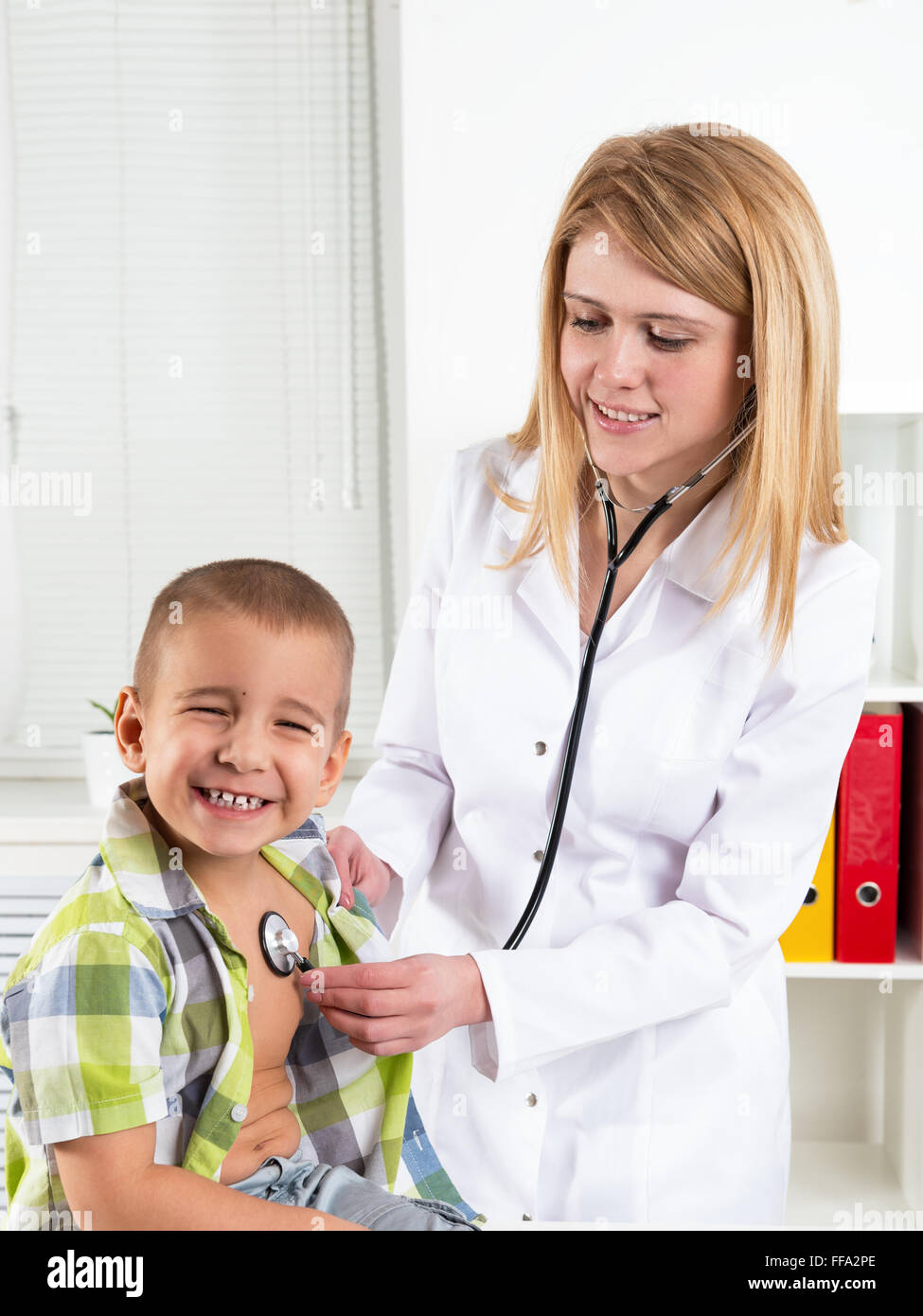 Portrait of a happy child in doctor's office Stock Photo - Alamy