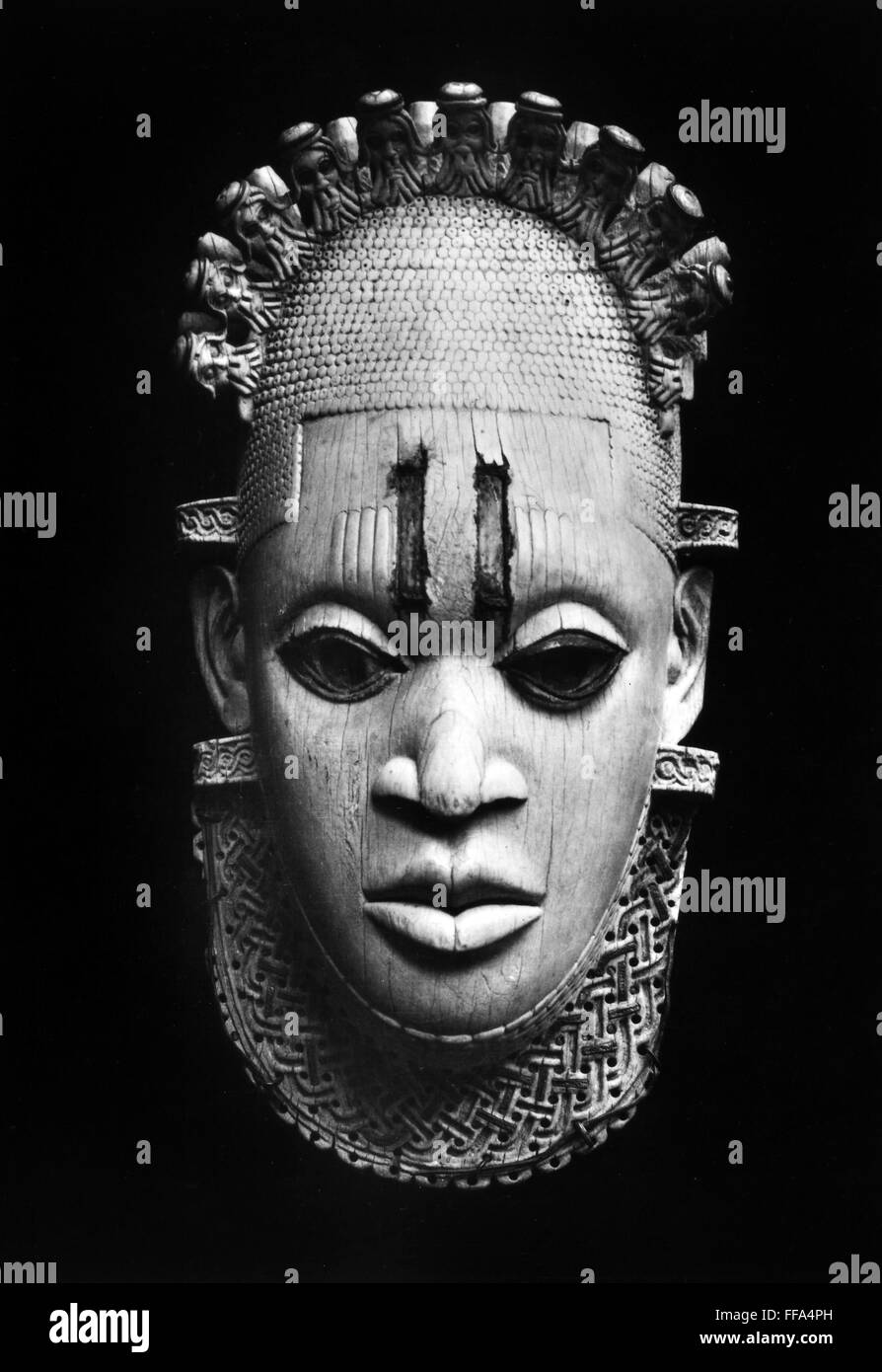 BENIN IVORY MASK. /nBearded heads of Portuguese traders decorate the ...