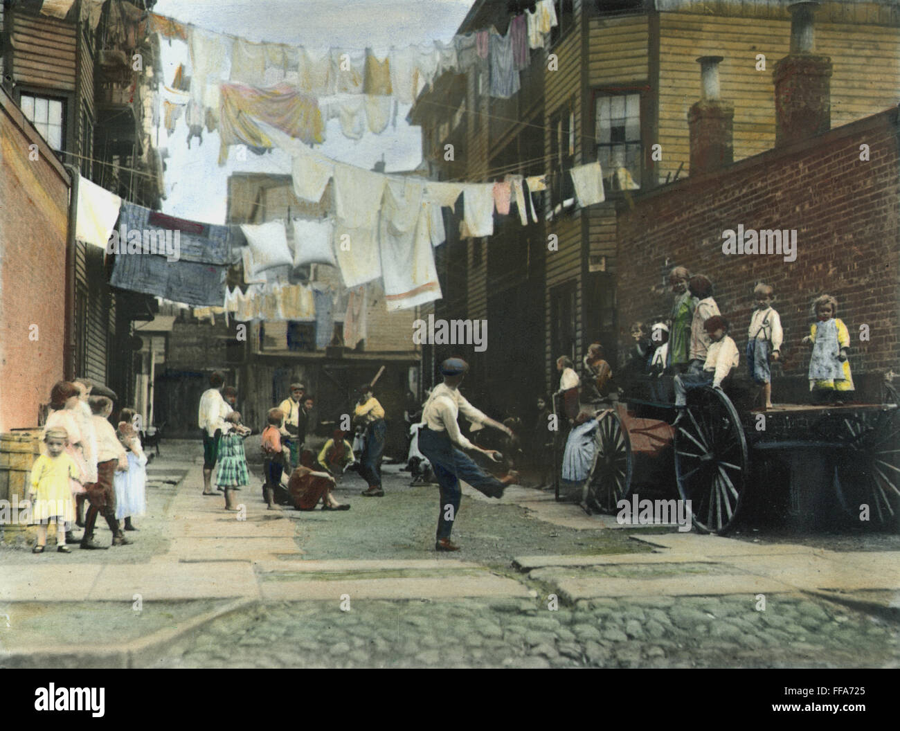 NYC TENEMENT LIFE. /nA playground in a tenement alley on New York City ...